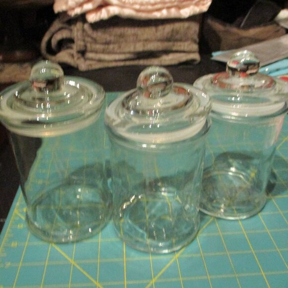 Bath | 3 Glass 1 Litre Cannisters With Glass Lids With Glass Balls On ...